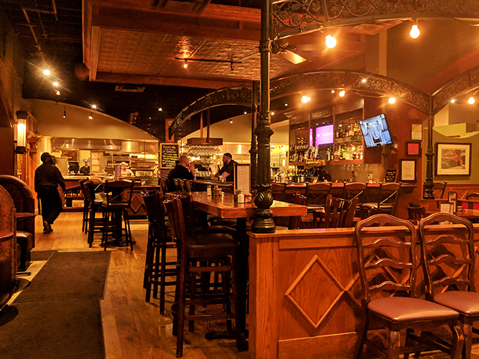 The bar area glows with amber light, promising libations crafted with the same care as the kitchen's seafood masterpieces.