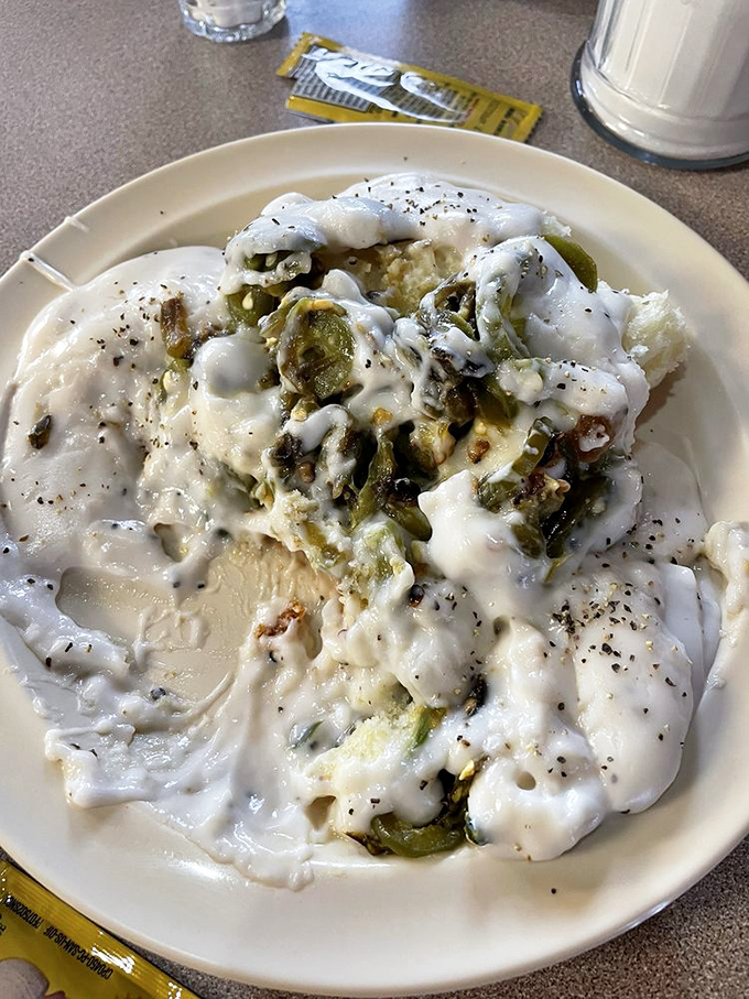 Two perfect biscuits with dual gravy dipping pools&mdash;proof that sometimes the best relationships come in pairs. Double the gravy, double the joy.