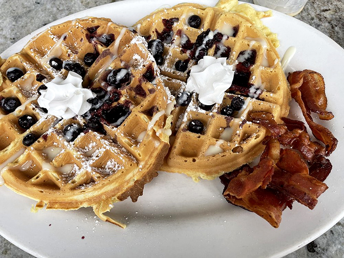 Golden waffles playing host to plump blueberries and real whipped cream. Somehow both fluffy and crisp – the morning miracle we all deserve.