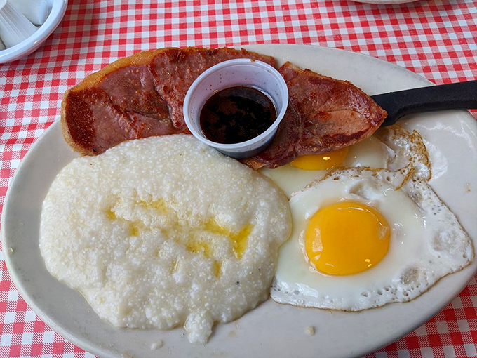 Country ham with that perfect salt cure alongside sunny-side up eggs &ndash; breakfast architecture that would make Frank Lloyd Wright jealous.