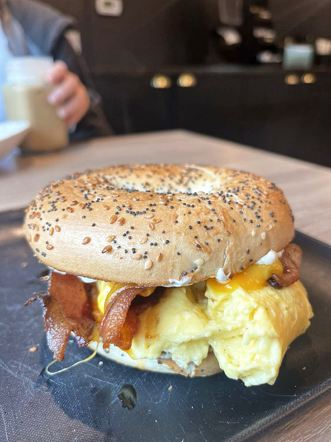 Breakfast sandwich architecture at its finest. That bagel deserves an engineering award for supporting such eggy, bacony magnificence.