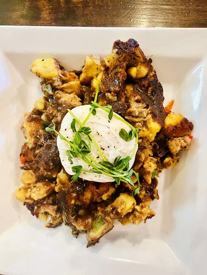 Hearty hash topped with a cloud-like poached egg and microgreens&mdash;the breakfast that says "you won't need lunch today."