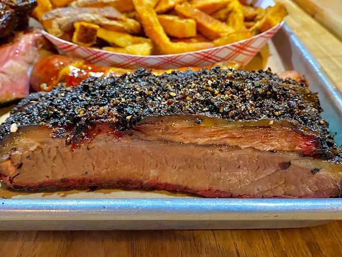 Brisket so tender it falls apart if you look at it too intensely. That pepper crust is the bouncer keeping all the juices inside.