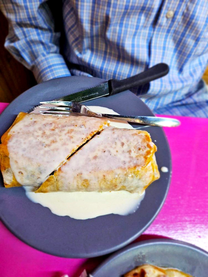 This isn't just a burrito—it's a flavor sleeping bag wrapped in a tortilla blanket and tucked in with a cream sauce pillow.