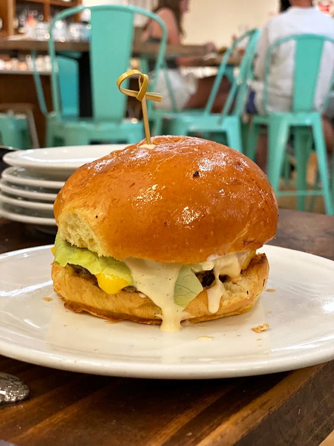 A burger so perfectly composed it deserves its own Instagram account, with cheese melting like sunrise over Charleston Harbor.