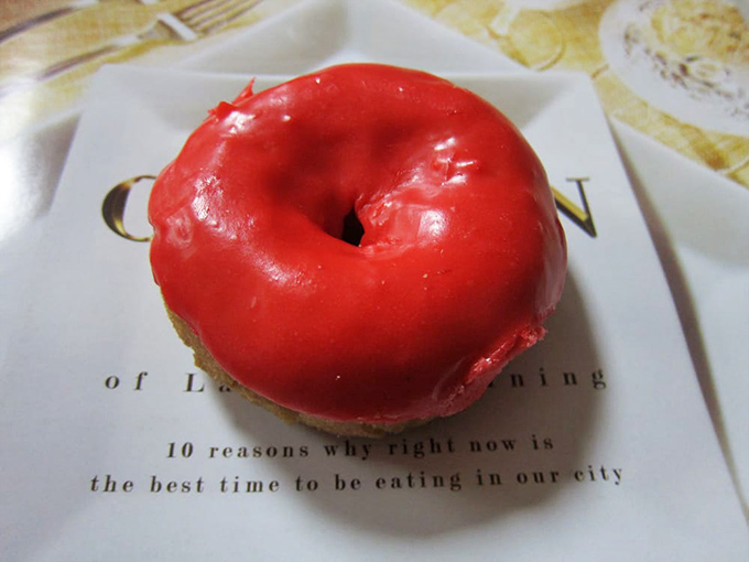 This cherry-red beauty isn't just a donut; it's a statement. It's saying, "Life's too short for beige breakfast foods!"