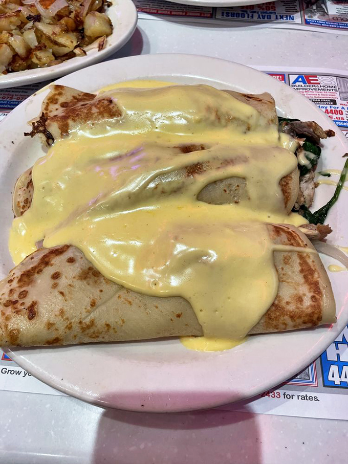 These chicken florentine crepes draped in hollandaise are what French cuisine might have evolved into if it had moved to Maryland and loosened its tie.
