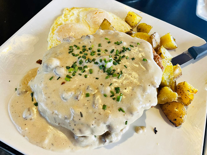 Country gravy cascading over crispy chicken fried steak like a delicious avalanche. Bring your appetite and possibly a backup stomach.