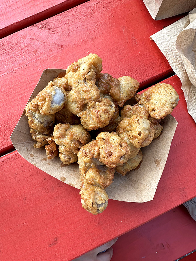 Golden chicken gizzards: The unsung heroes of roadside cuisine that separate the curious food adventurers from the merely hungry travelers.