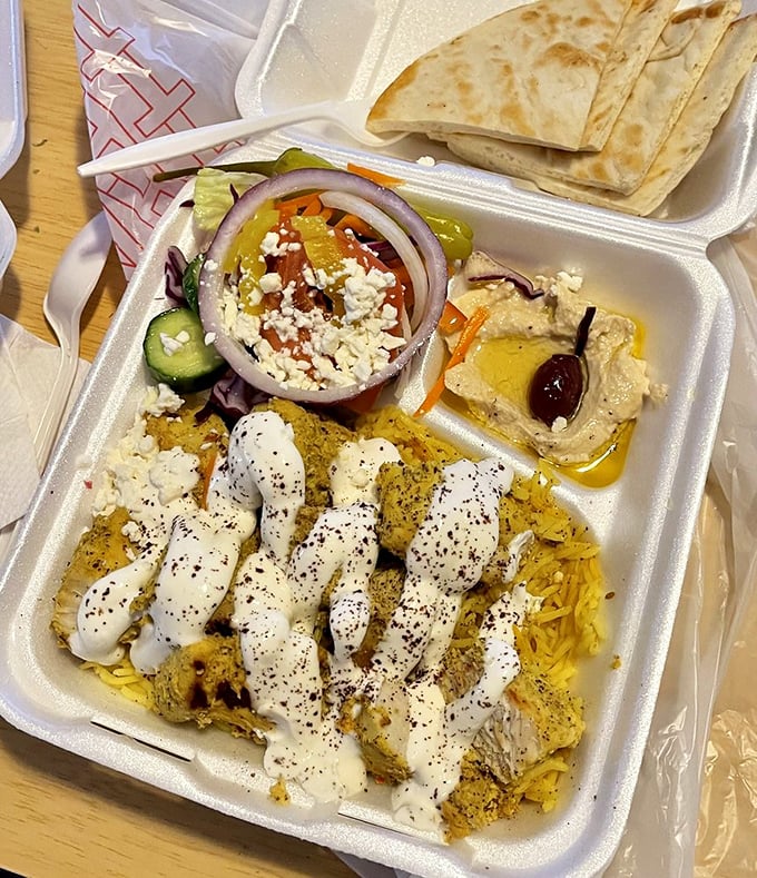 A feast fit for Zeus himself: rice, protein, hummus, and salad. The four food groups of "why can't I stop eating this?"