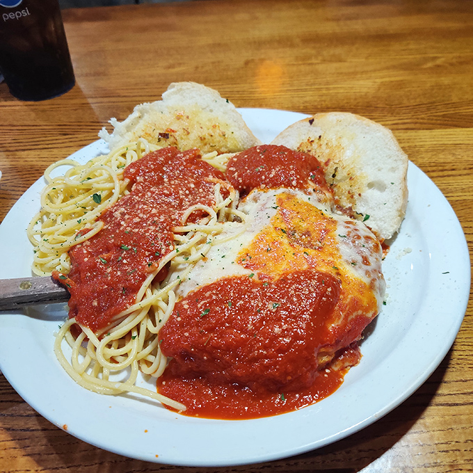 Chicken Parmesan with spaghetti that would make any Italian grandmother nod in approval. Red sauce this good deserves its own fan club.