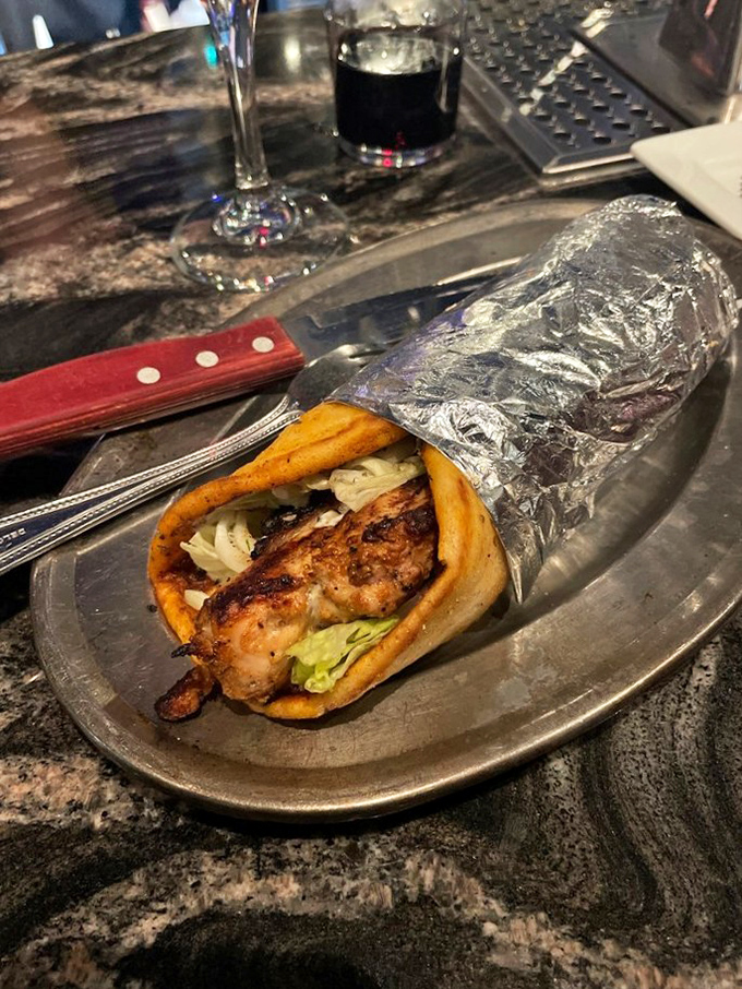 This chicken sandwich isn't just lunch; it's a Mediterranean vacation between two pieces of pita, no passport required.