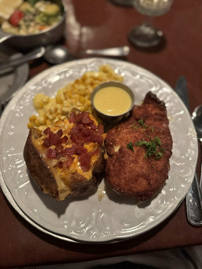 A loaded baked potato and perfectly breaded cutlet&mdash;proof that sometimes the classics endure because they're simply unbeatable, like The Beatles or comfortable shoes.