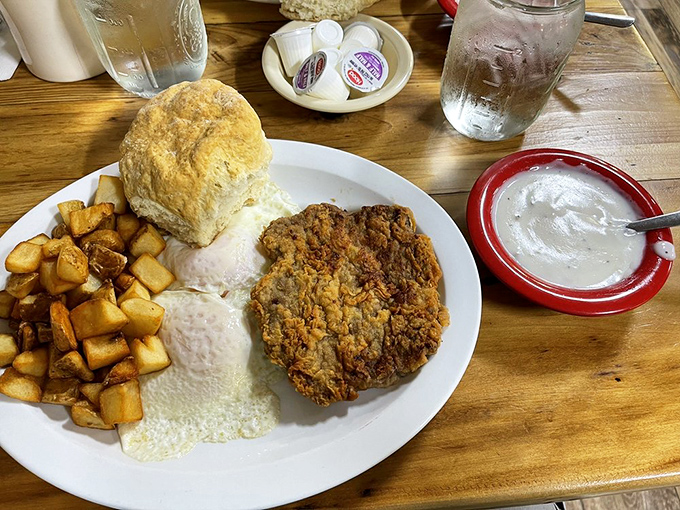 Country-fried steak with a side of happiness. That gravy isn't just a topping – it's practically a philosophical statement about generosity.