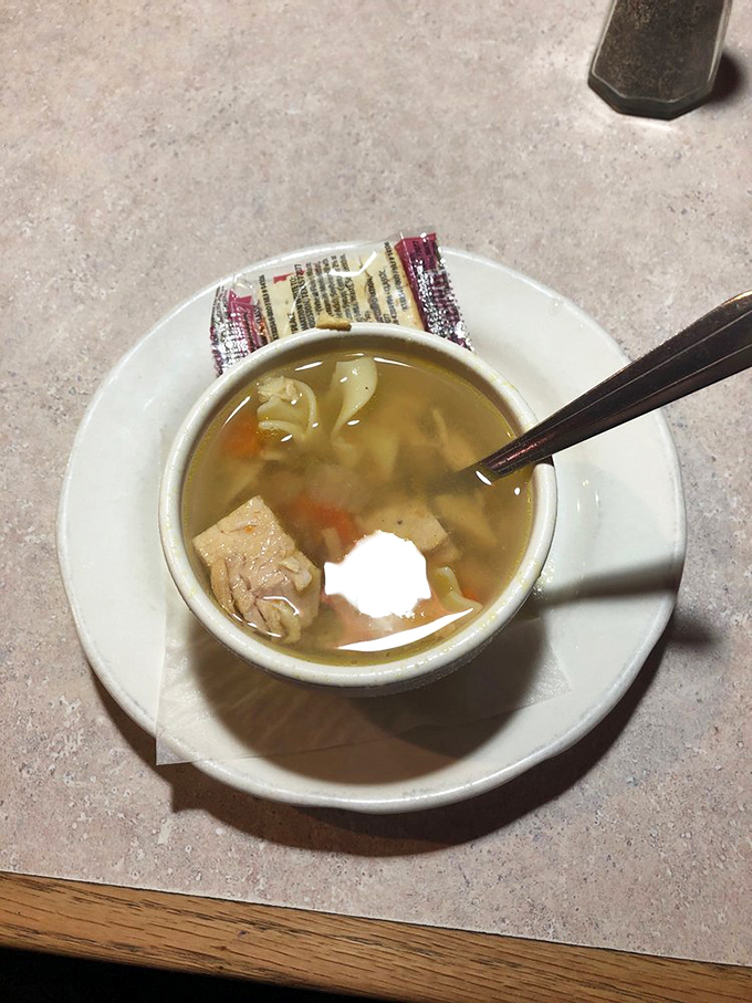 A humble cup of chicken noodle soup that whispers, "Everything's going to be okay" &ndash; comfort in liquid form with generous chunks of chicken.