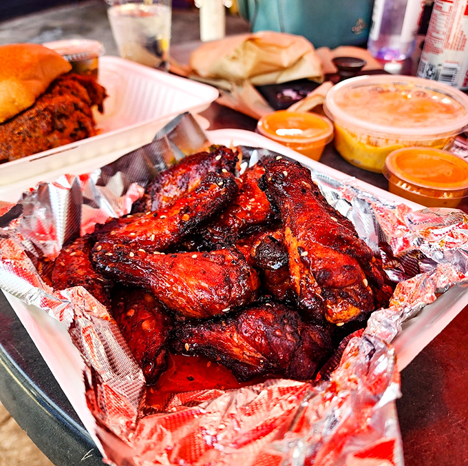 Wings that have clearly graduated from barbecue finishing school. That glossy, caramelized exterior hints at the sweet-heat symphony waiting inside.