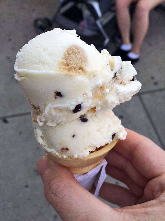 Cookie dough ice cream stacked high on a waffle cone. Those little nuggets of dough are like buried treasure waiting to be discovered with each bite.