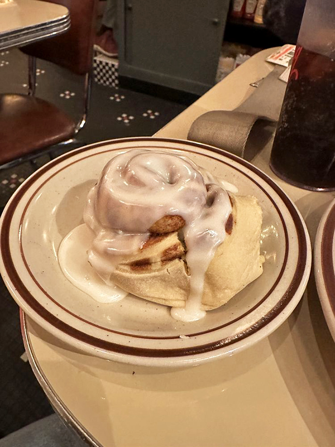 A cinnamon roll that doesn't understand the concept of personal space&mdash;and thank goodness for that. Frosting applied with Midwestern generosity.