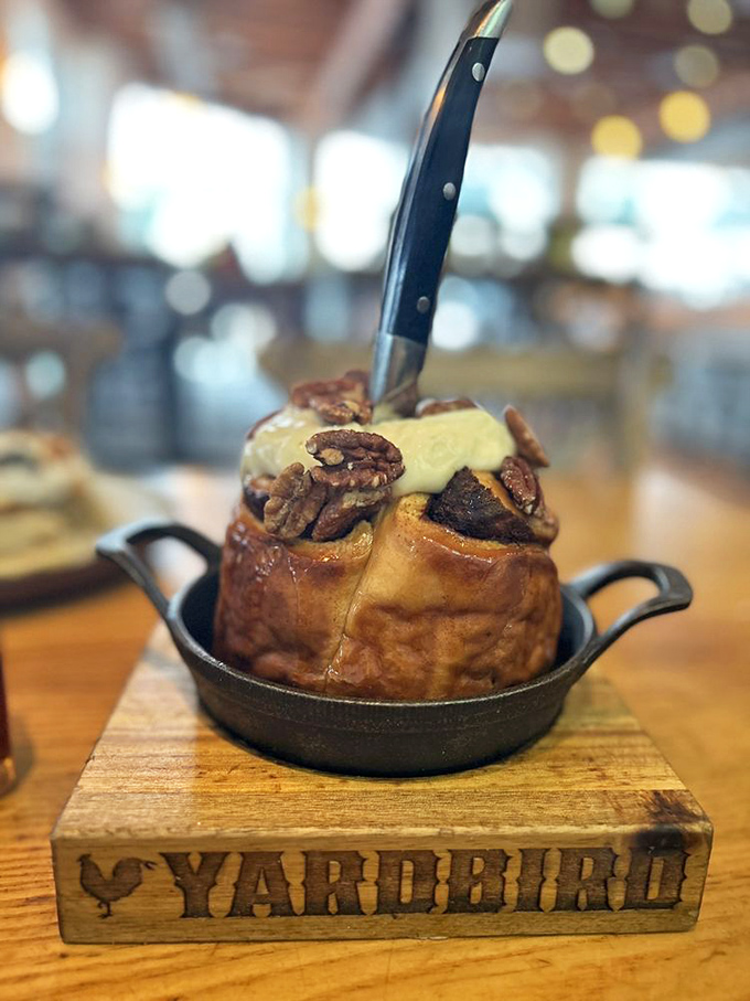 Hello, beautiful stranger! This cinnamon roll, crowned with pecans and cream, is what breakfast dreams are made of.