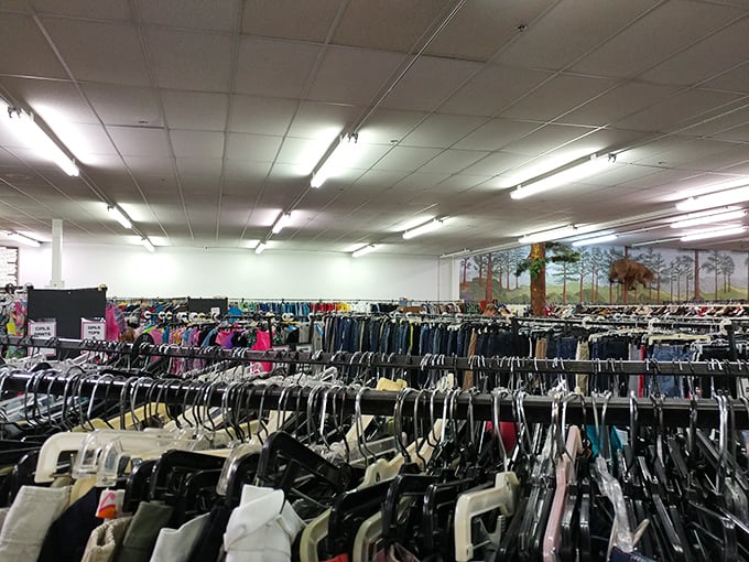 The clothing section stretches as far as the eye can see, organized by type rather than the chaotic jumble found in lesser secondhand shops.