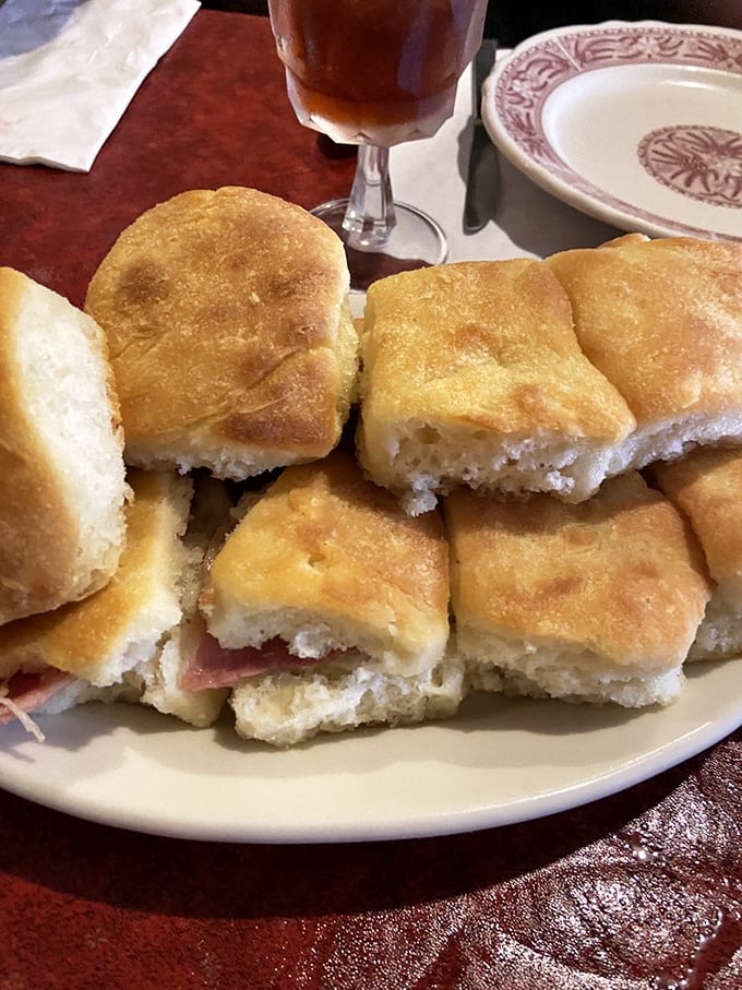 Country ham biscuits arranged like edible dominoes&mdash;one falls into your hand, then your mouth, then suddenly they're all gone.