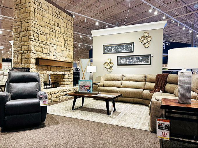 Stone fireplace meets plush seating in a display that whispers, "Netflix marathon" and "snow day" in the most inviting way possible.