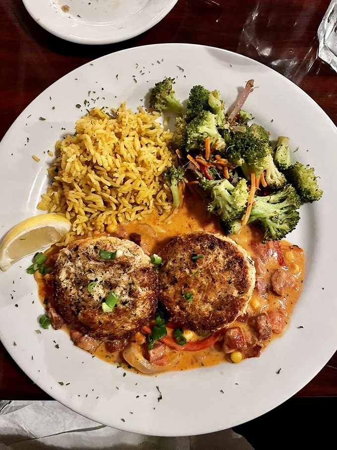 These aren't just crab cakes&mdash;they're edible evidence that sometimes the best things in life come in pairs, especially when served with rice and broccoli.