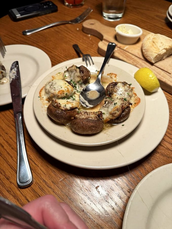 These mushrooms aren't just stuffed&mdash;they're overachieving. Seafood, cheese, and fungi in perfect harmony on that sizzling plate.