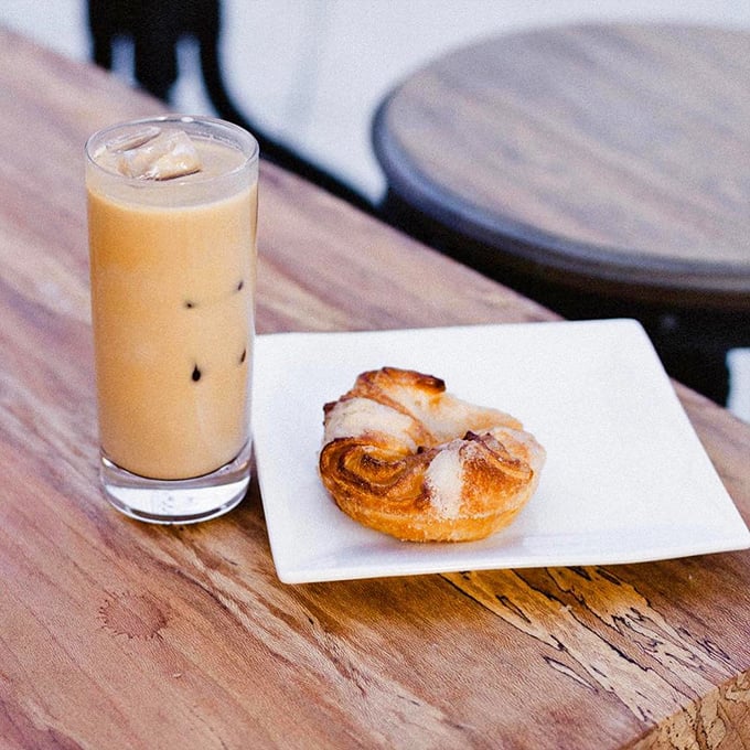 Iced coffee and pastry: the dynamic duo of productive mornings. That cinnamon roll isn't just food&mdash;it's motivation in carbohydrate form.