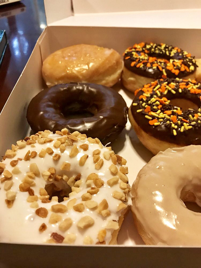 Six reasons to share (or not): from simple glazed to festive sprinkles, this box represents both the democracy and the dilemma of donut selection.