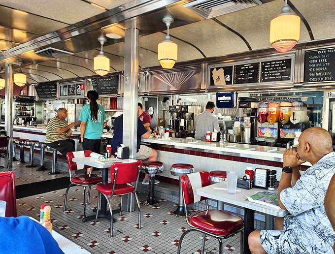 The counter crowd knows the secret—sitting here gives you front-row seats to the short-order ballet and first dibs on fresh coffee refills.