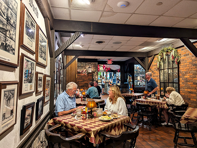 Generations of diners have created memories at these tables. The wall of photographs isn't just decor&mdash;it's visual proof that good taste runs in families.
