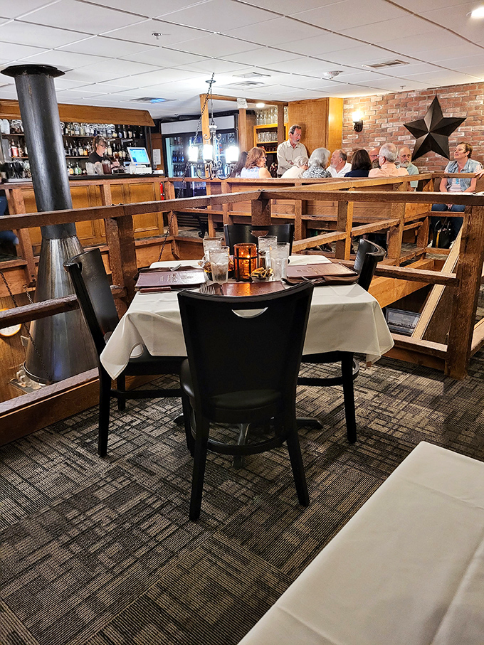 Where conversations happen naturally. The tiered seating and warm wooden interior create the perfect backdrop for both intimate dinners and celebrations.