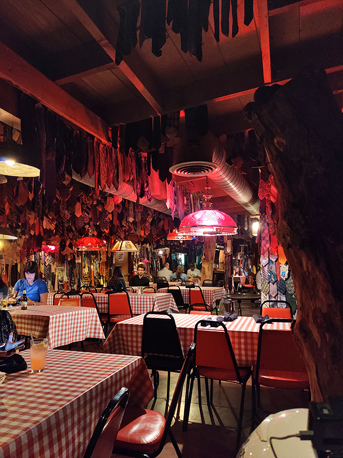 The walls are adorned with enough ties to outfit several corporate boards, creating a colorful tapestry of business casual rebellion.