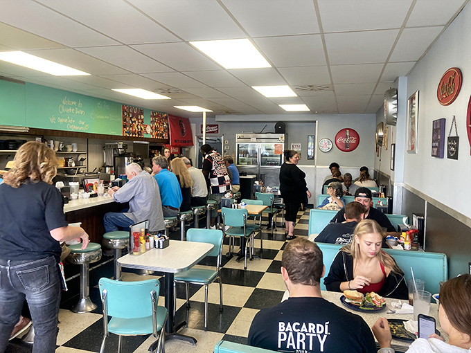 The beautiful choreography of diner life - servers weaving between tables, regulars claiming their usual spots, and newcomers discovering breakfast bliss.