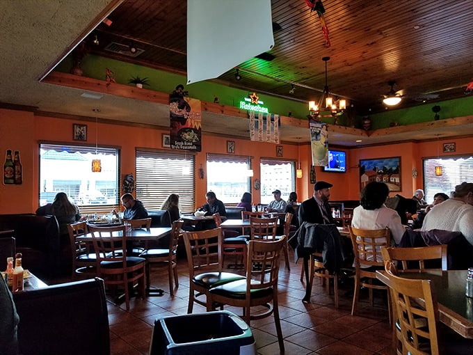 A different dining area showing Peru, Illinois knows how to create atmosphere. Those orange walls radiate warmth like a Mexican sunset.