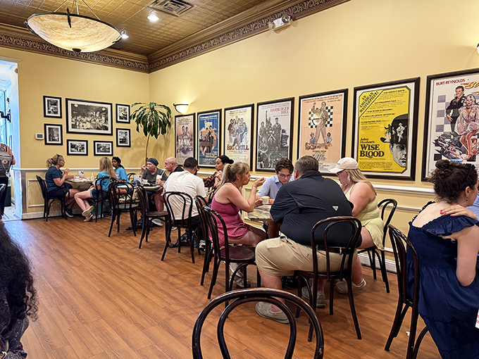 The dining room buzzes with the universal language of dessert happiness. These visitors aren't just eating ice cream—they're collecting Savannah memories.