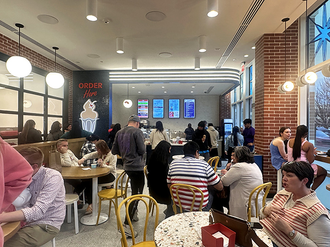 The modern soda fountain balances nostalgia with efficiency—where strangers become friends united by the universal language of "mmmmm."