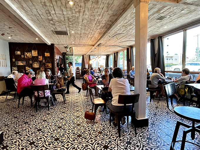 The patterned floor tiles and whitewashed ceiling create a space where Santa Fe meets Saint-Germain, and everyone's invited to the party.