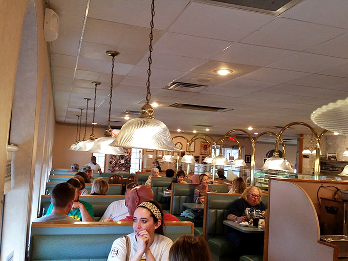 Where strangers become neighbors and neighbors become friends – the dining room hums with conversation and the clinking of coffee cups.