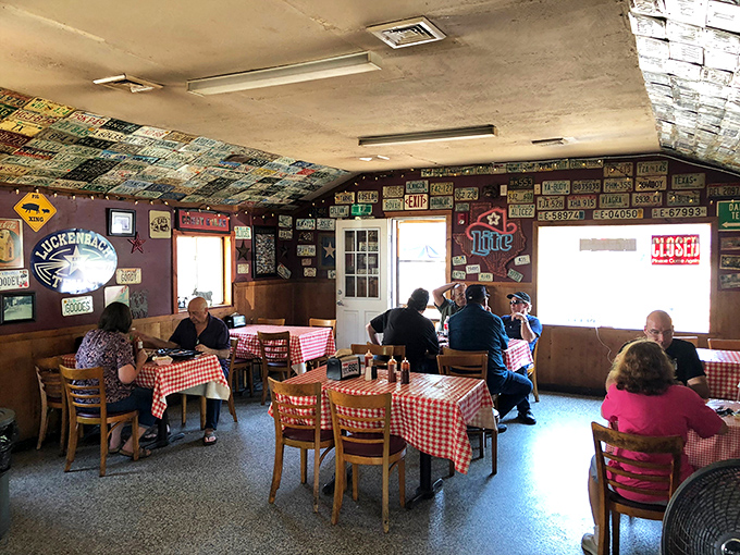 Where barbecue enthusiasts gather to worship at the altar of smoke and meat. The silence between bites tells you everything. 