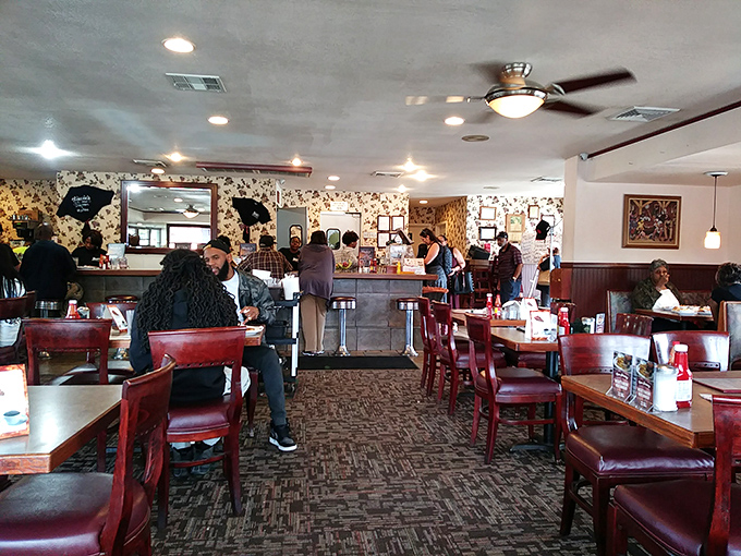 The dining room hums with the energy of satisfied customers. Notice how nobody's looking at their phones? That's the power of food worth paying attention to.
