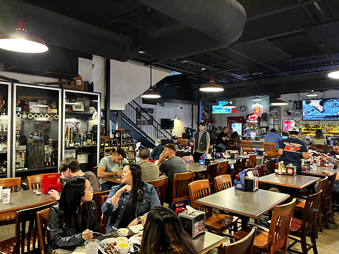 A diverse crowd united by one thing: the pursuit of exceptional barbecue. In this room, strangers become friends over shared plates.