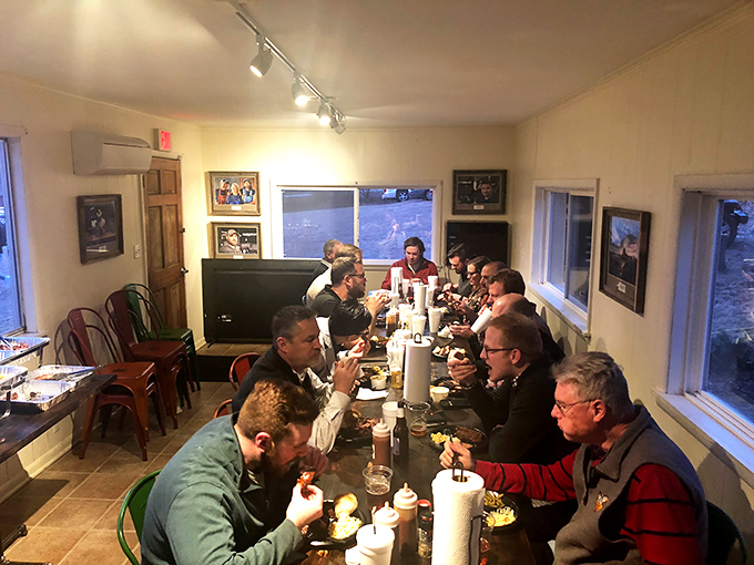 Breaking bread and sharing meat&mdash;this communal table scene captures the true spirit of barbecue culture in the American South.