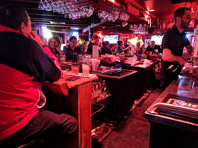 The bar scene at Nate's hums with conversation and clinking glasses. This is where seafood stories are shared and appetites are born.