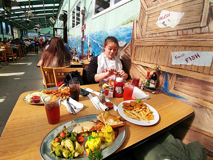Outdoor dining with hand-painted murals creates the perfect backdrop for seafood feasts. Even the walls celebrate the ocean's bounty.