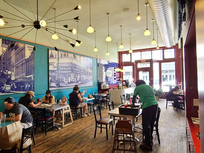 Where locals and visitors become temporary family. Those historic photographs on turquoise walls tell stories while new ones unfold at every table.