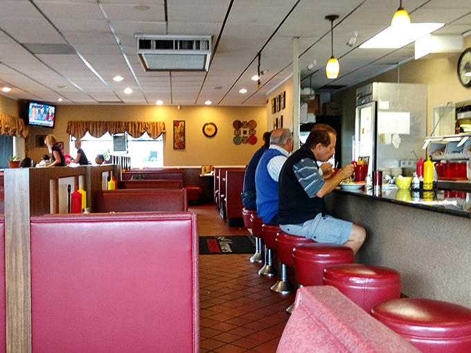 Where locals gather and visitors become regulars. These red booths have heard more Michigan stories than any history book ever written.
