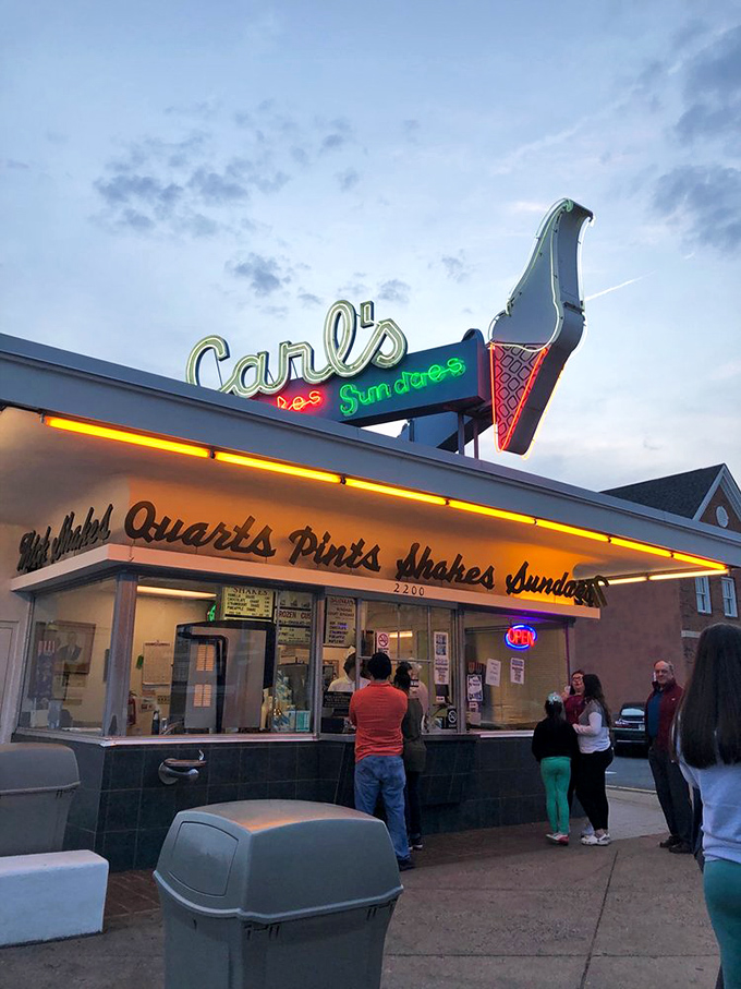 As dusk falls, Carl's neon sign glows like a lighthouse guiding dessert pilgrims home. Some places just look better at magic hour.