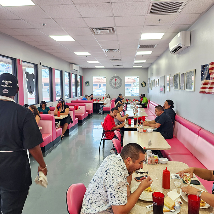 A snapshot of happiness: diners lost in the blissful trance of good food and great company. It's like watching a silent movie where the plot is "Yum!"